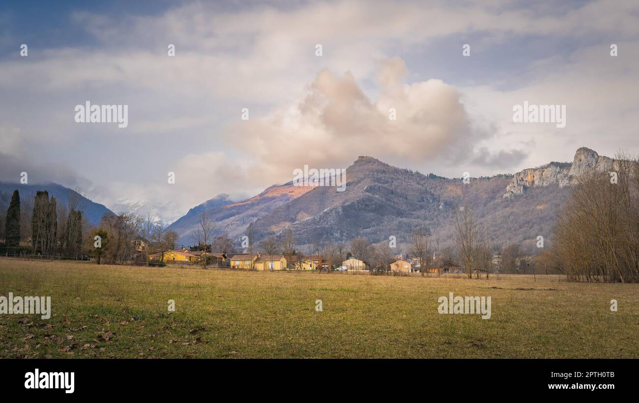 Surba town hiding behind trees at the foothill of Pyrenees Mountains ...