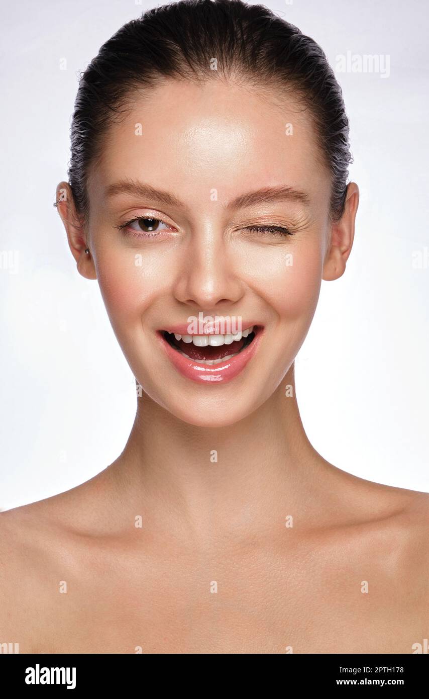 Portrait of beautiful woman with light natural make-up and perfect skin ...