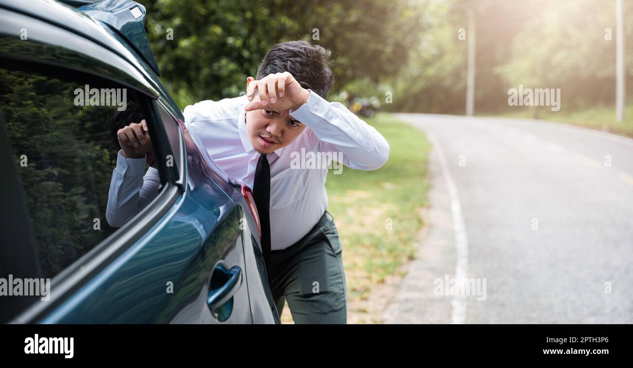 Asian businessman car broken has problems with car down during go to ...