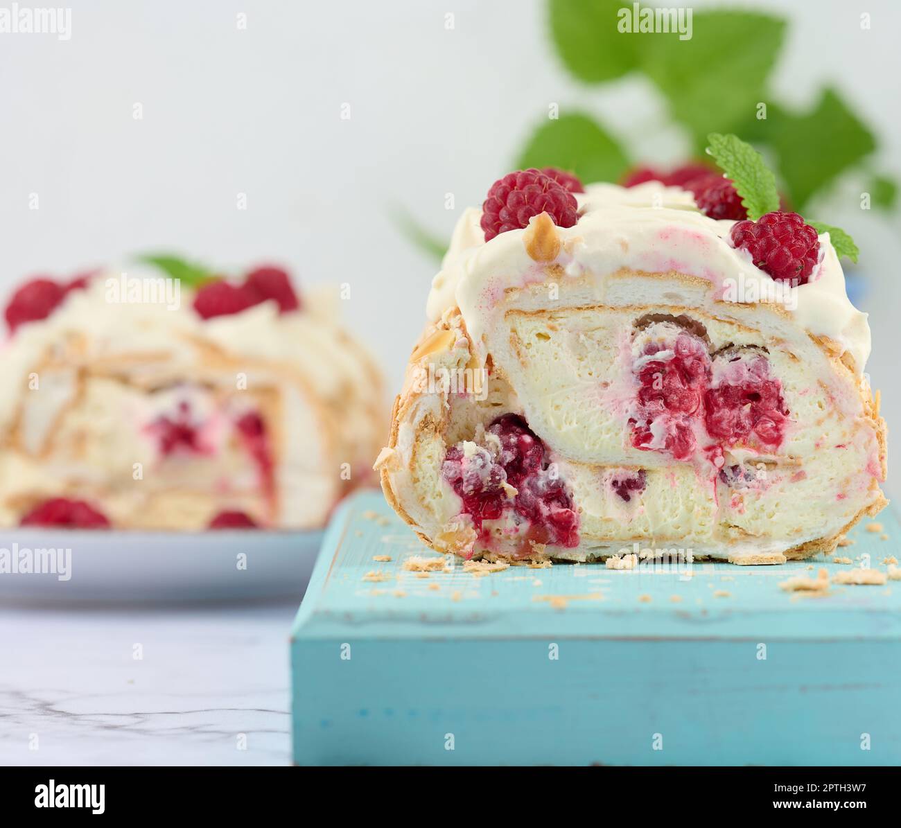 Baked meringue roll with cream and fresh red raspberry, white ...