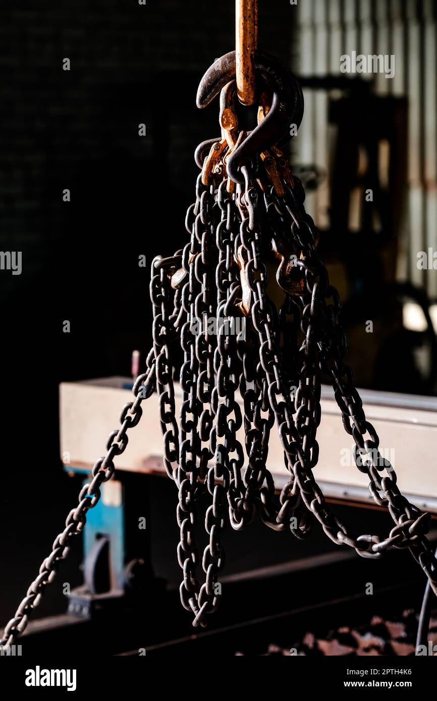 steel chain hook of electric hoist. industrial background Stock Photo ...