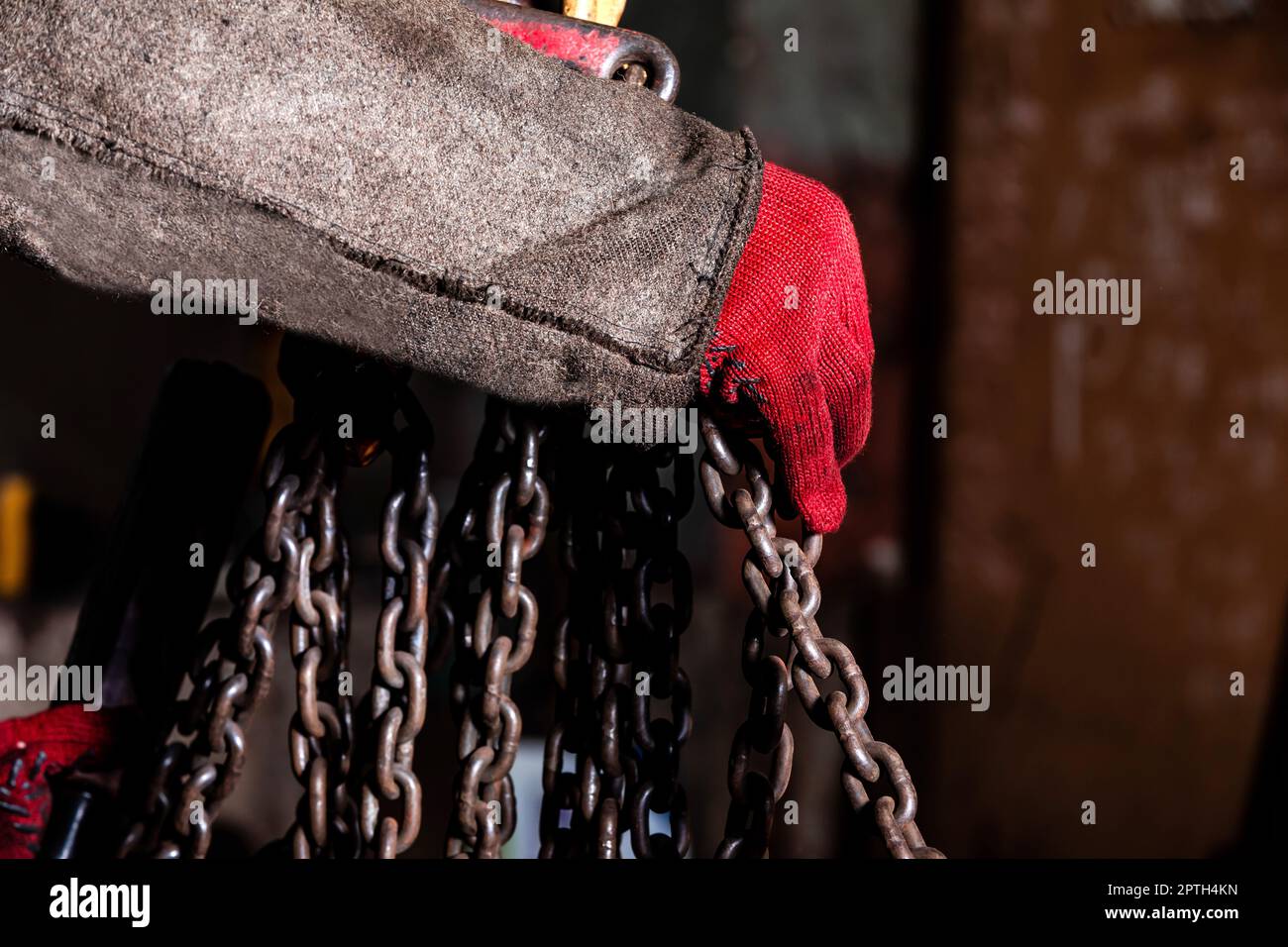 industry worker is working with hook of electric hoist crane Stock ...