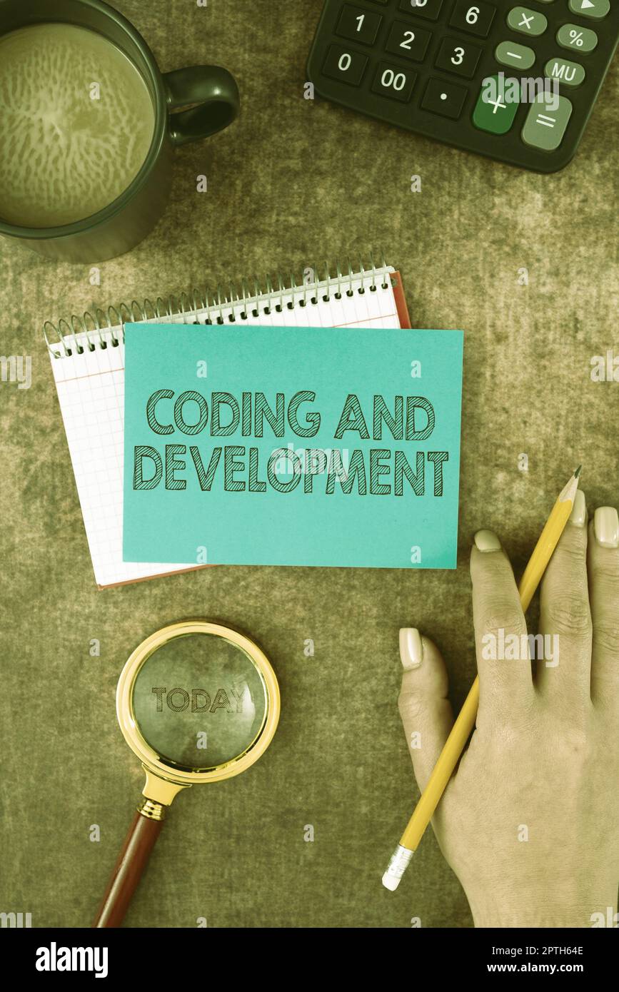 Hand writing sign Coding And Development, Business approach Programming ...