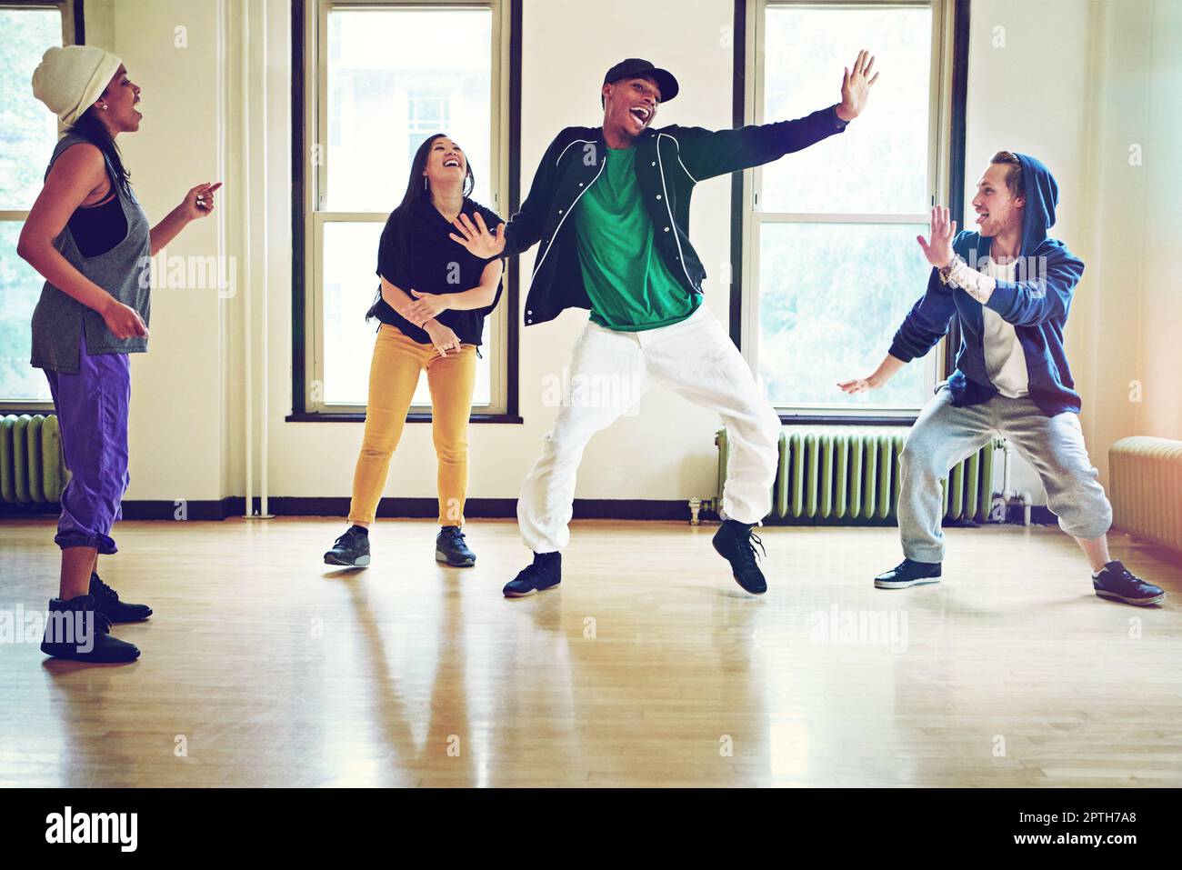 Celebrate life through movement. a group of young friends dancing ...