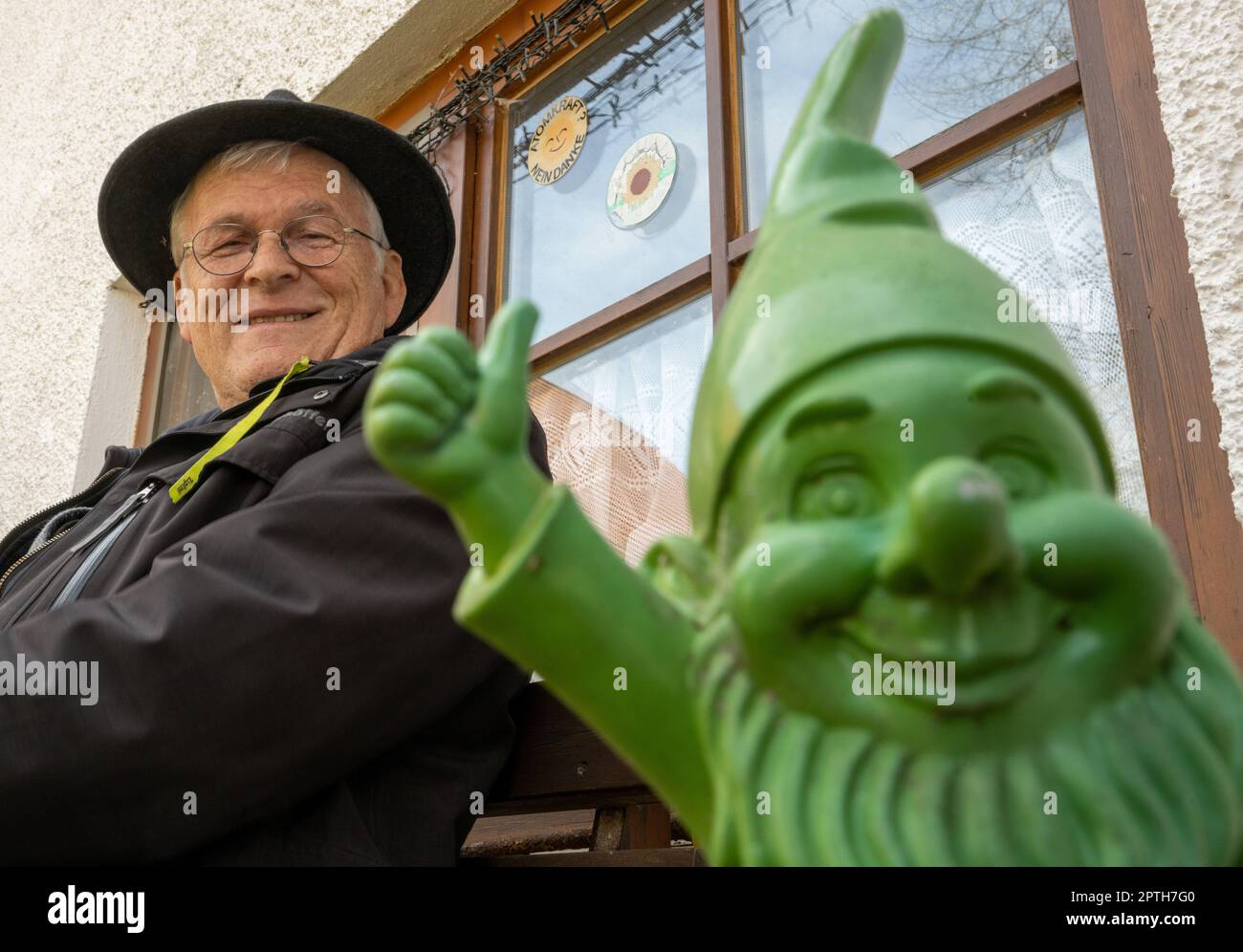 Maselheim, Germany. 27th Apr, 2023. Elmar Braun sits next to a green ...
