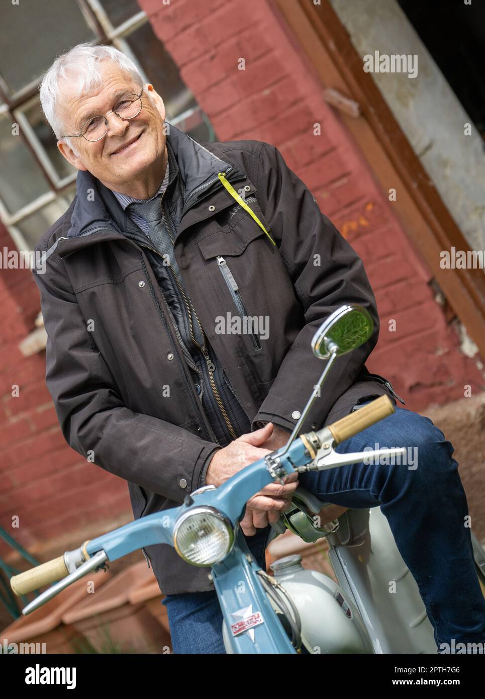 Maselheim, Germany. 27th Apr, 2023. Elmar Braun sits on an NSU Quickly ...