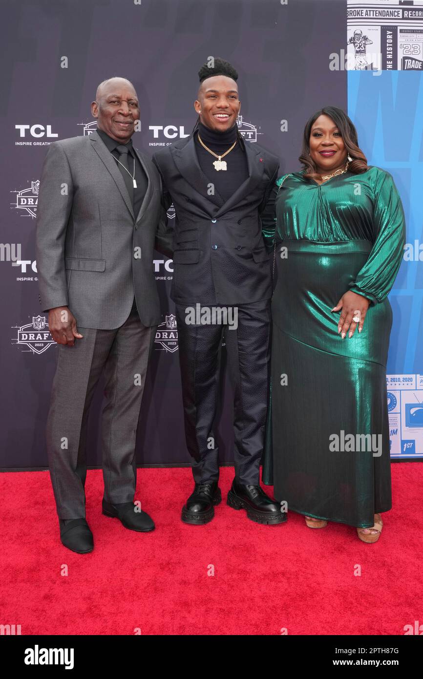 Texas running back Bijan Robinson and family pose on the NFL draft red carpet, Thursday, April ...