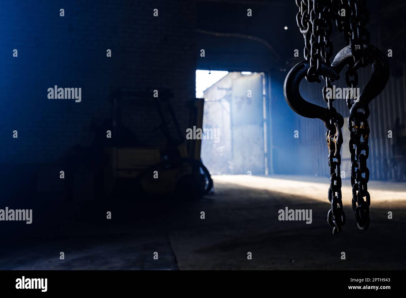 steel chain hook of electric hoist. industrial background Stock Photo ...
