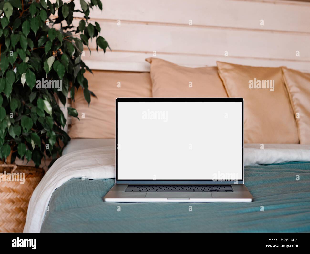 Laptop blank screen on wood table with wooden wall bedroom interior ...