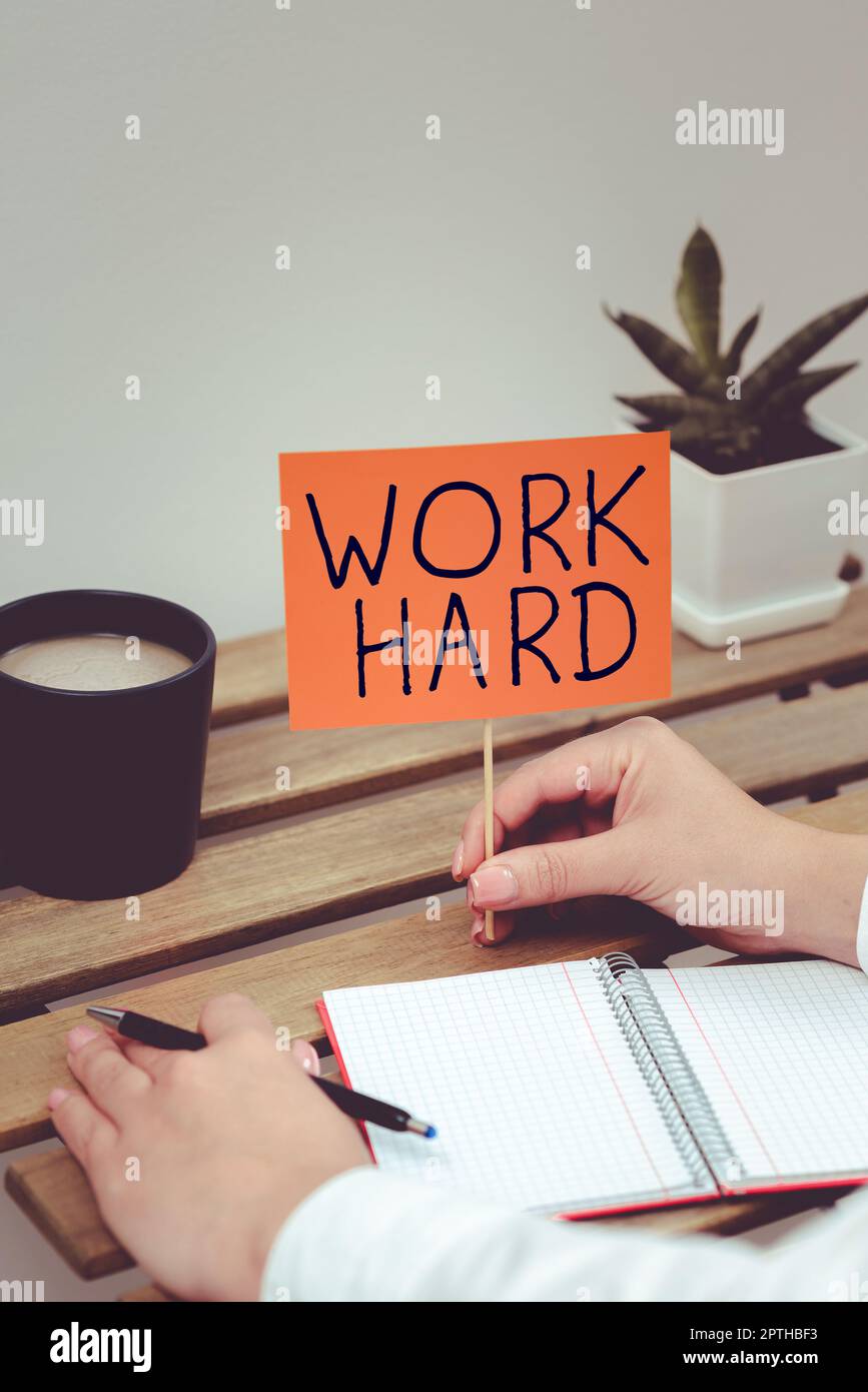 Hand writing sign Work Hard, Business showcase Laboring that puts ...