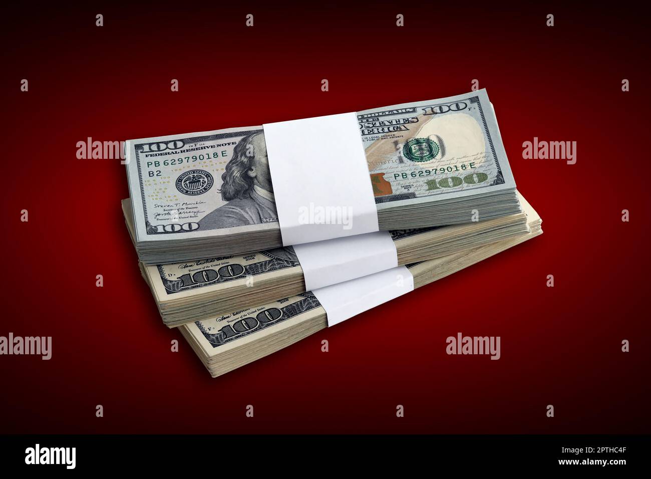 Bundle of US dollar bills on crimson red background. Pack of american ...