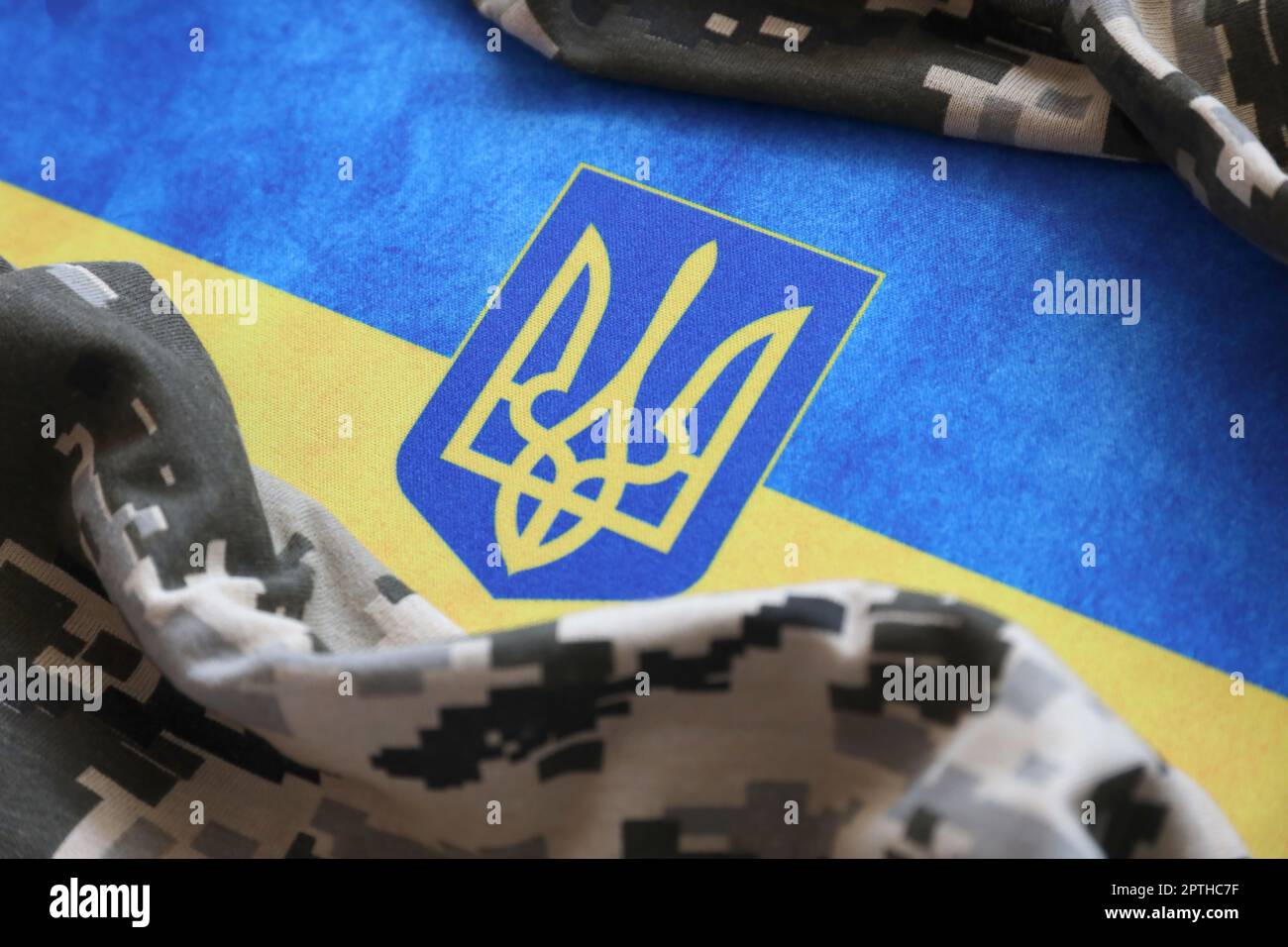 Ukrainian flag and coat of arms with fabric with texture of pixeled ...