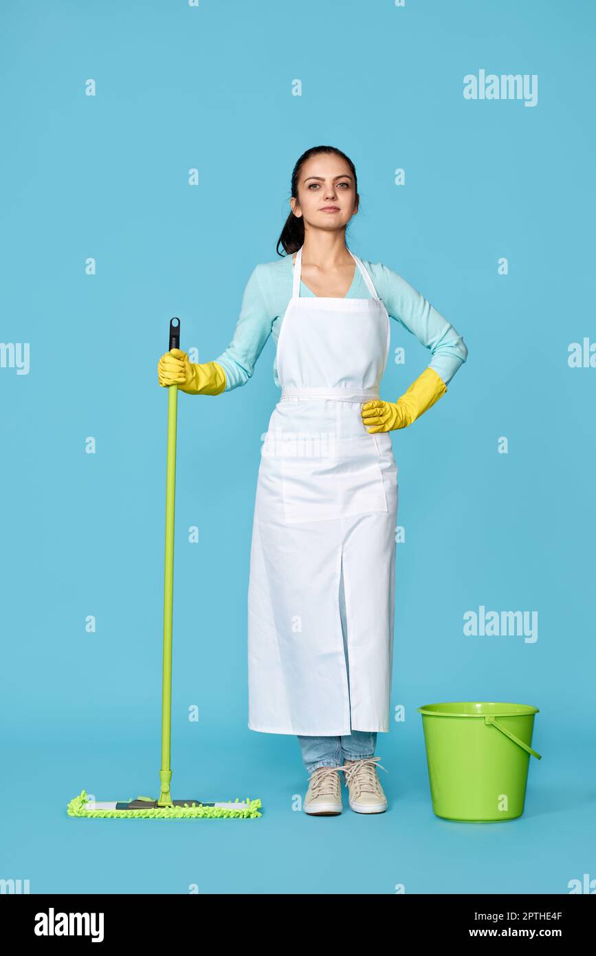 professional cleaner girl in rubber gloves and cleaner apron washing ...