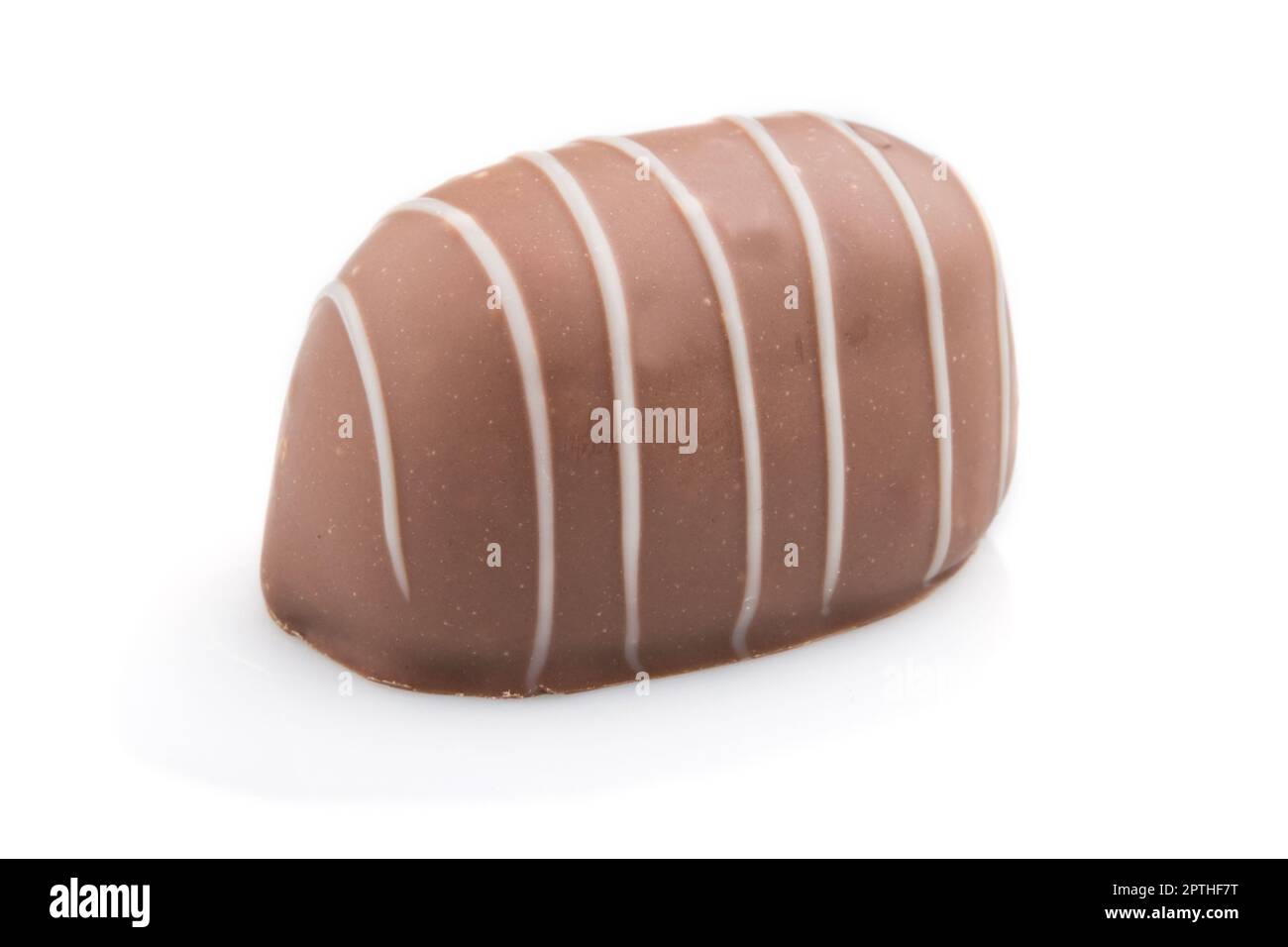 Single chocolate candy isolated on white background. side view, close ...