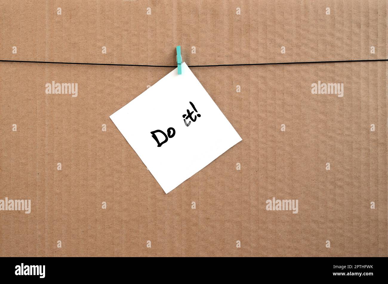 Do it! Note is written on a white sticker that hangs with a clothespin ...