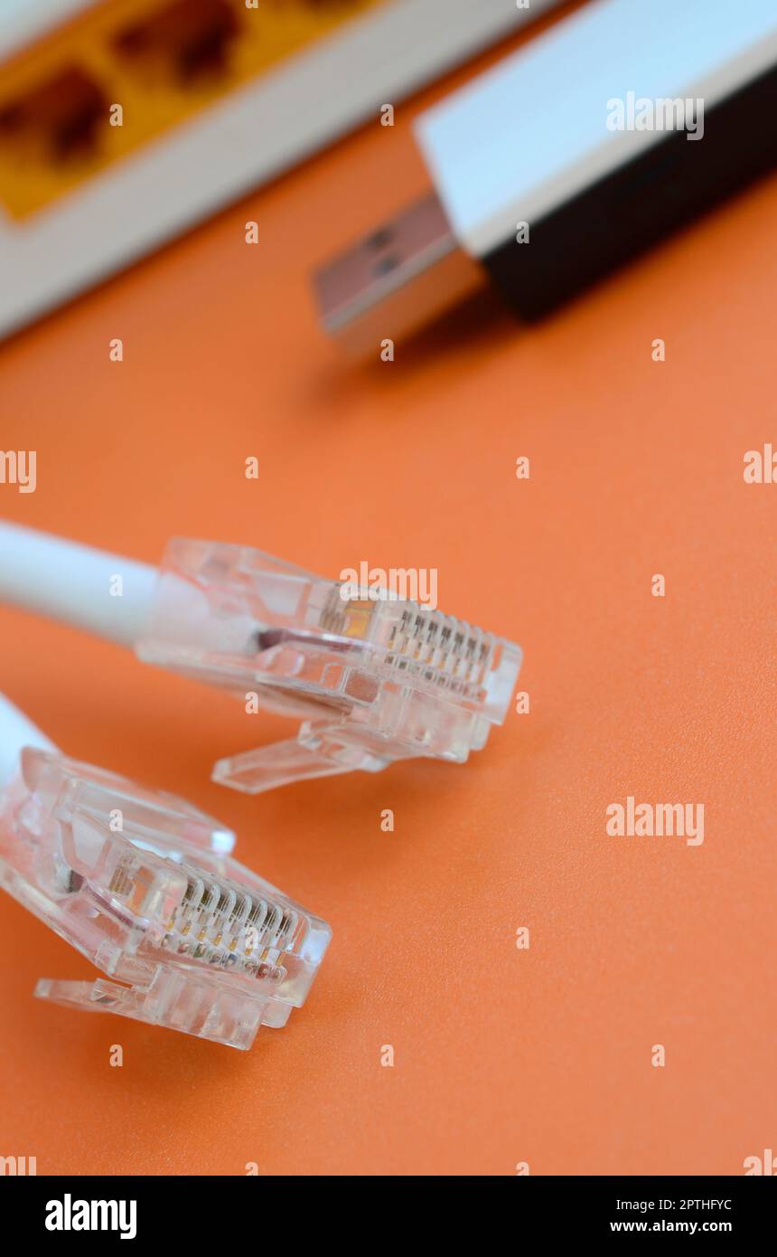 Internet router, portable USB wi-fi adapter and internet cable plugs ...