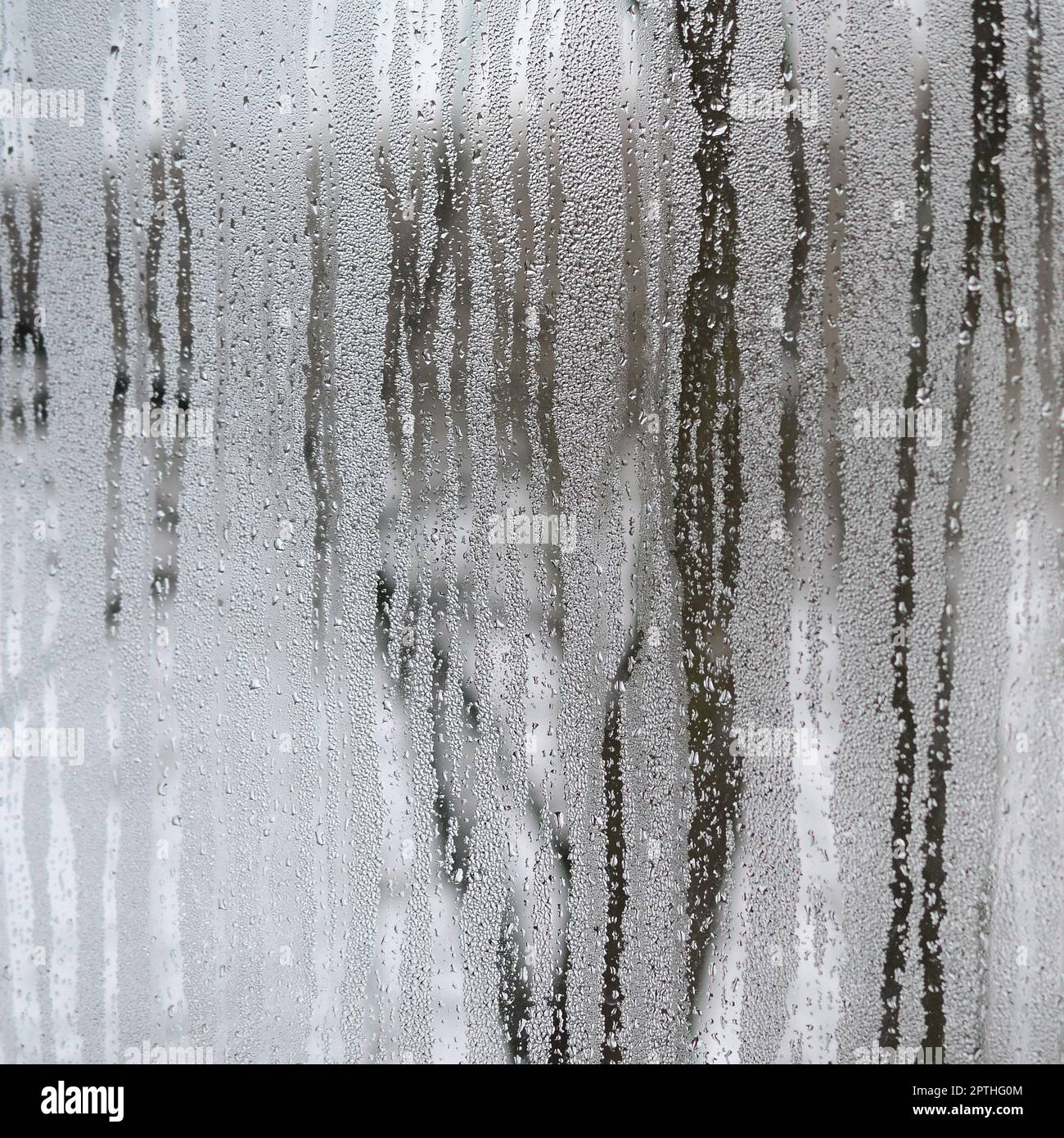 The texture of a misted glass with a lot of drops and condensation ...