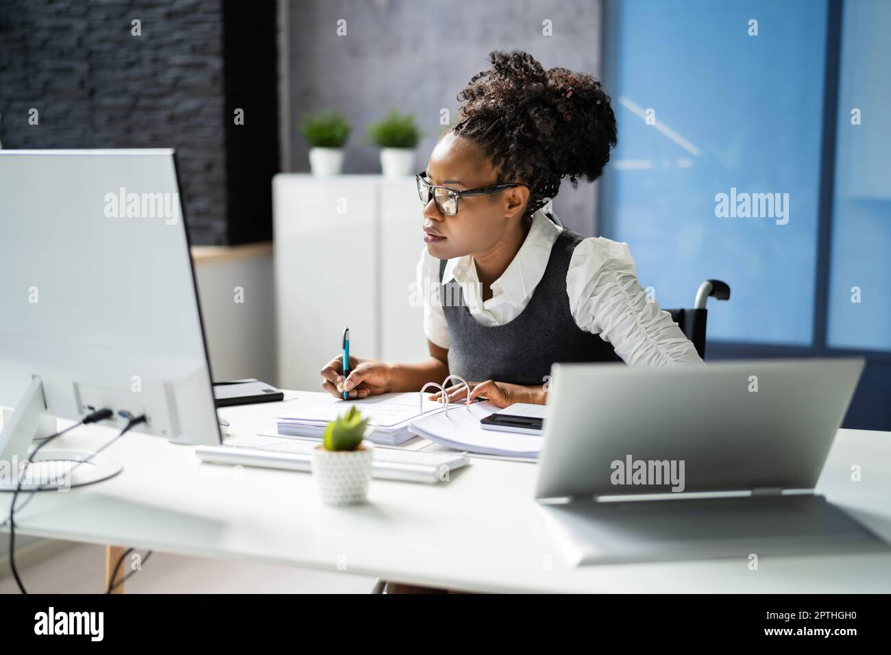 African American Tax Professional Female With E Invoice Stock Photo - Alamy