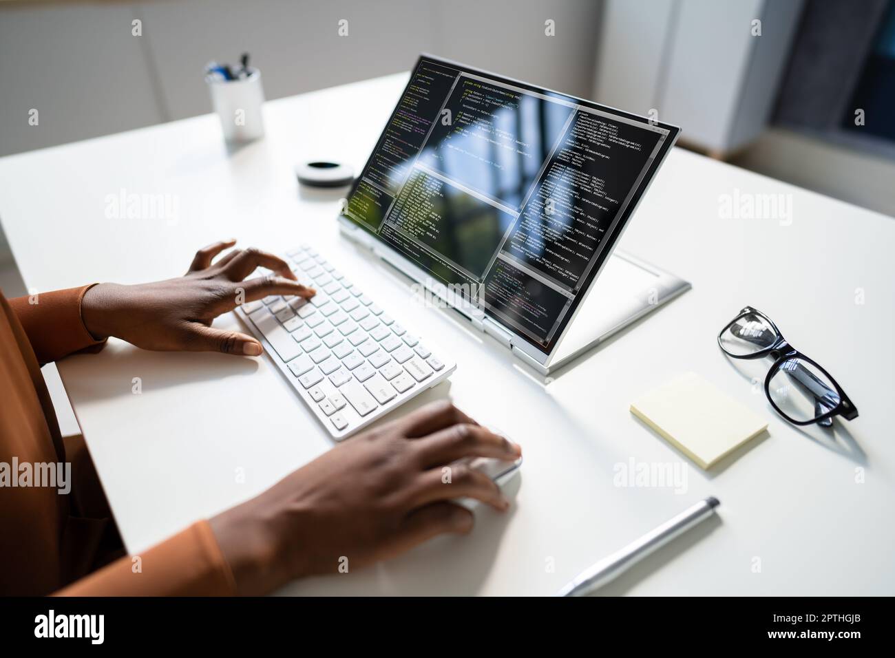 African American Coder Using Computer At Desk. Web Developer Stock ...