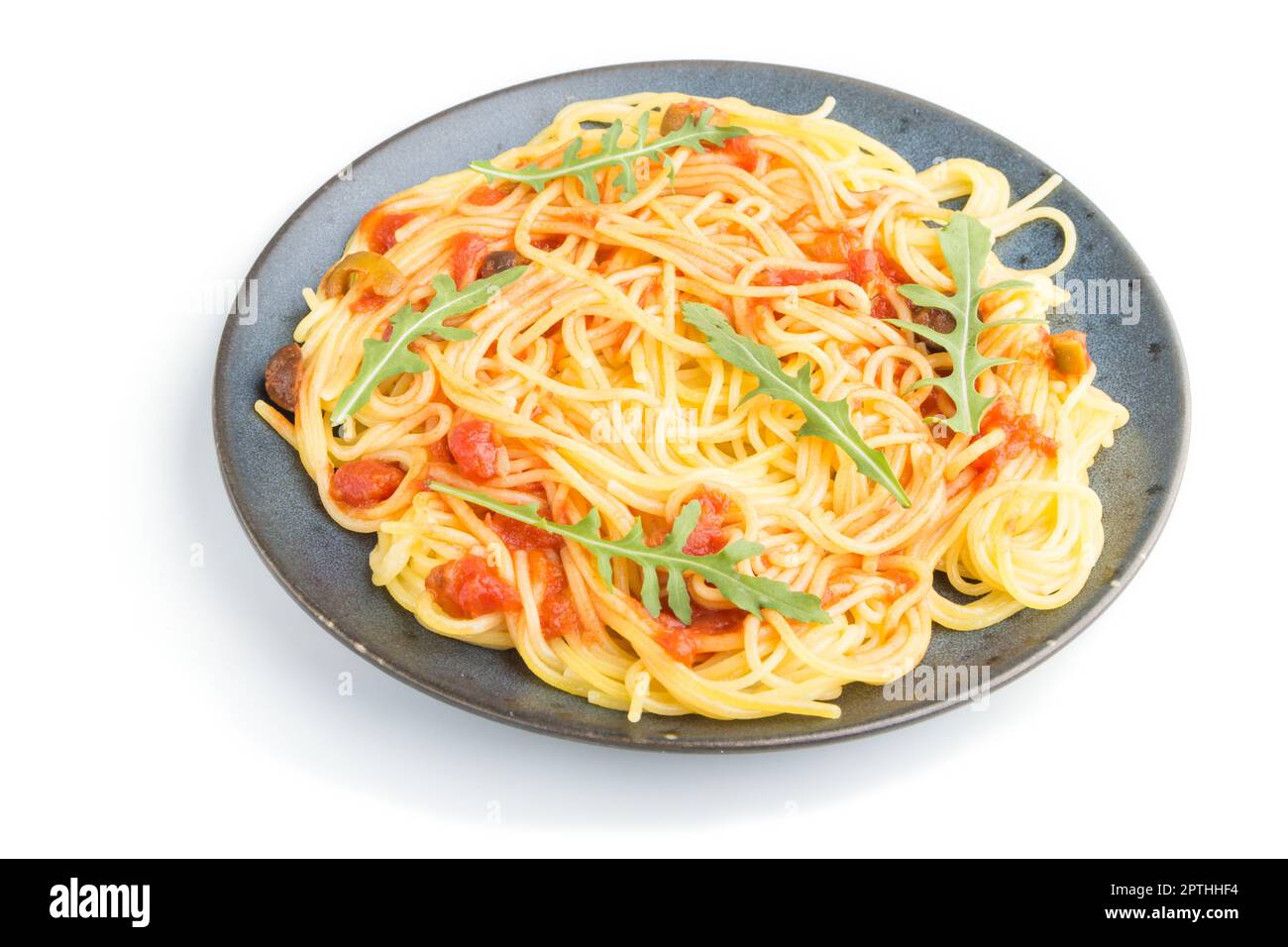Corn noodles with tomato sauce and arugula isolated on white background ...