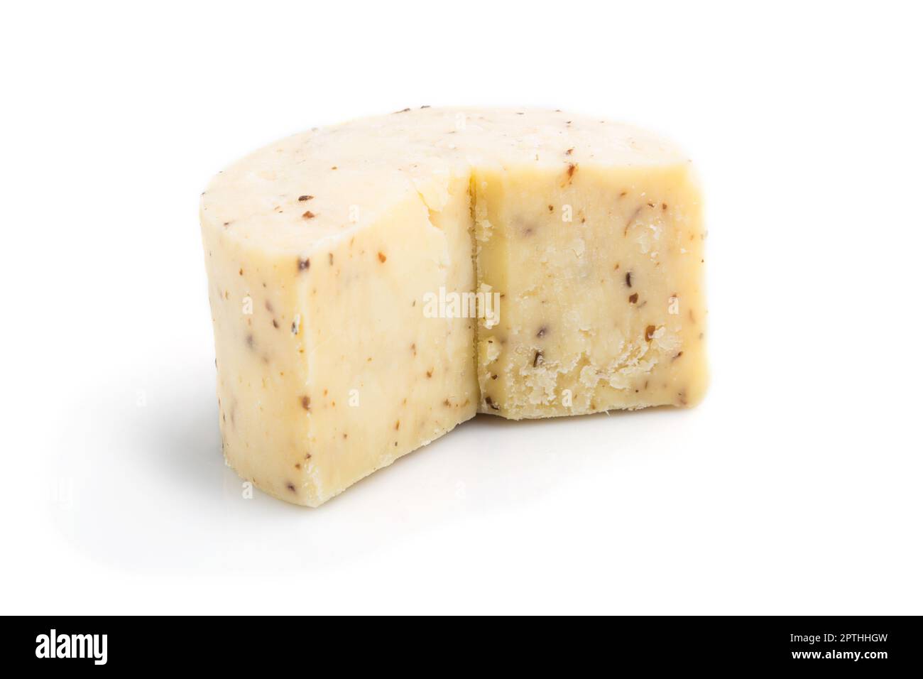 Piece of cheddar cheese isolated on white background. Side view, close ...