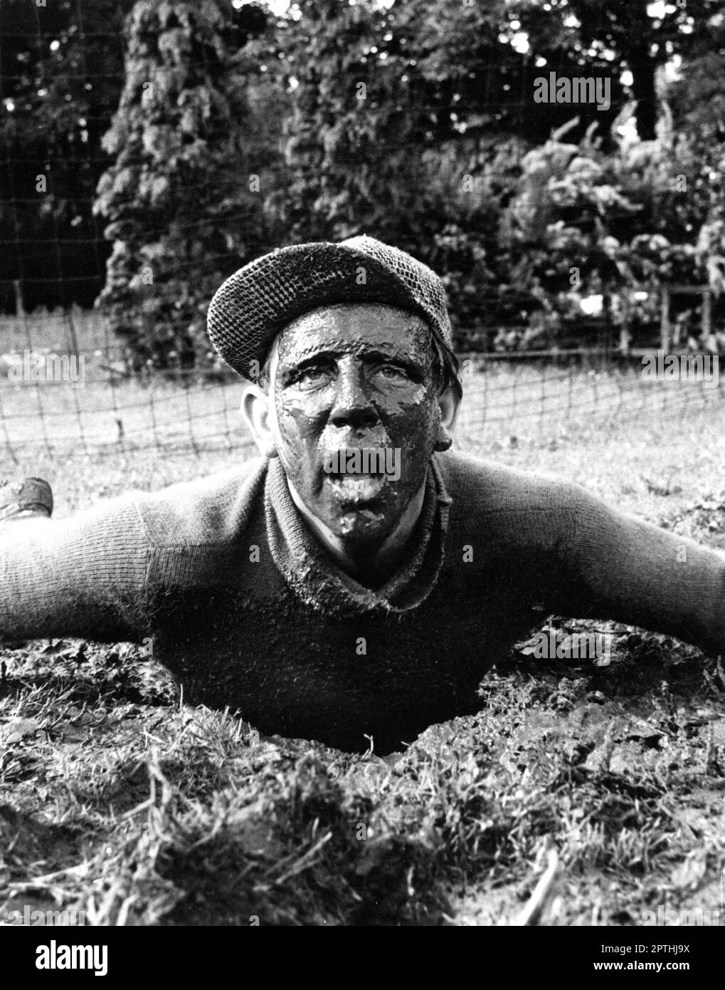 NORMAN WISDOM as mud covered goalkeeper in football match in UP IN THE ...