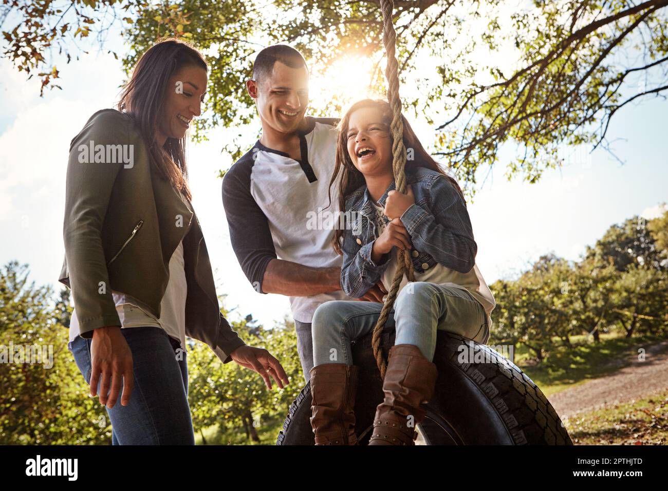 Young and full of energy. a happy mother and father pushing their ...