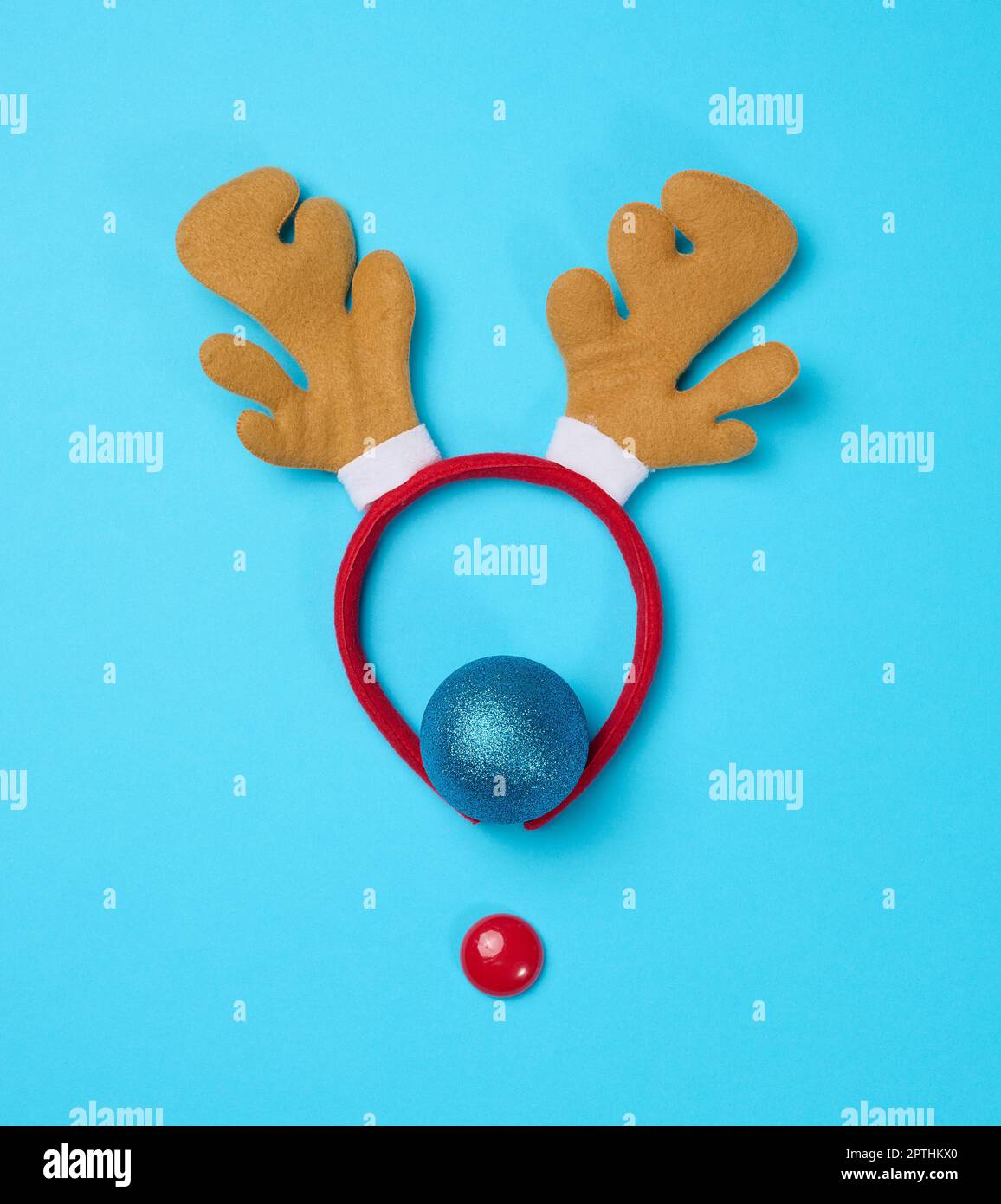 Christmas deer costume with antlers on the head on a blue background ...