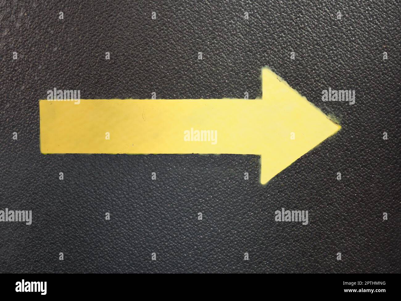 right arrow direction sign yellow paint on glass Stock Photo - Alamy