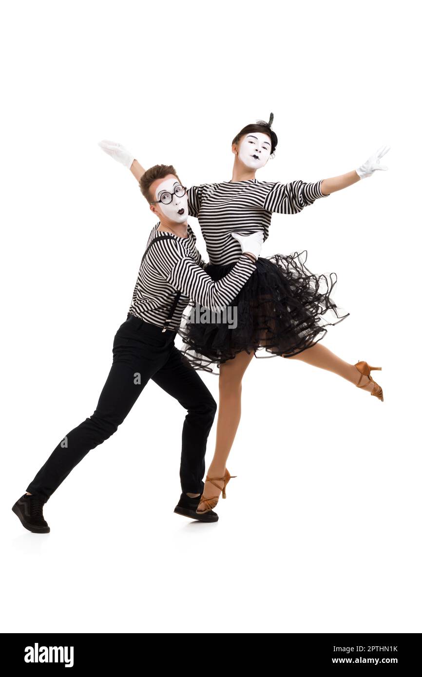 Full-length portrait of mimes in striped shirts. Man and woman dressed ...
