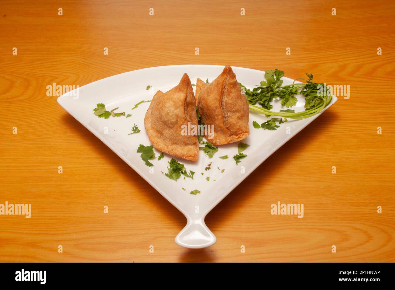 Authentic Indian cuisine known as vegetable somosa Stock Photo - Alamy