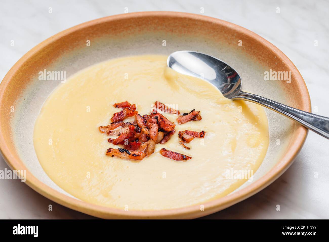 yellow peas porridge with bacon strips Stock Photo - Alamy