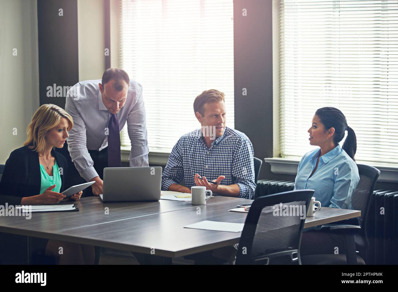 The best brain power in one room. a group of colleagues having a ...