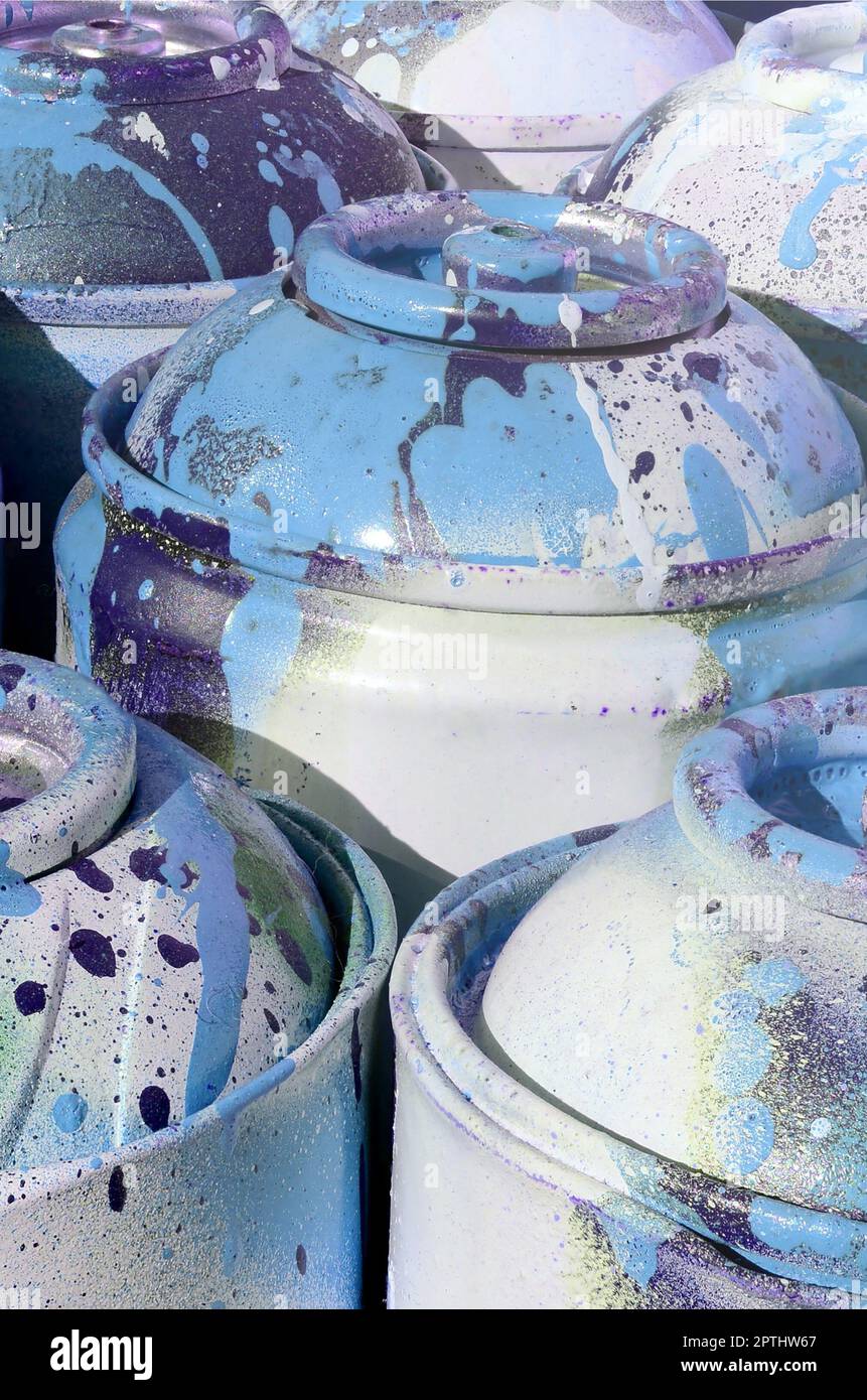 A lot of used blue metal tanks with paint for drawing graffiti Stock ...