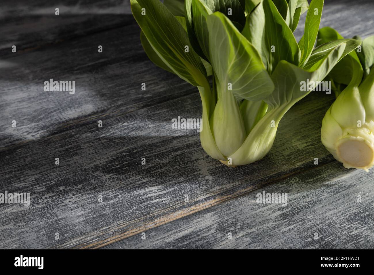 Fresh green bok choy or pac choi chinese cabbage on a gray wooden ...