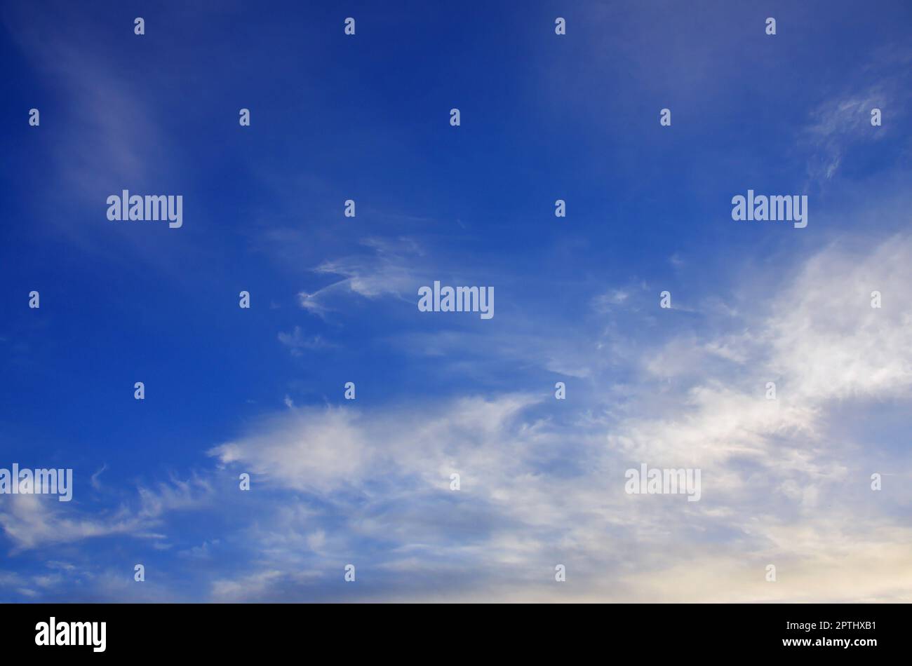 Heavenly space of blue color with a lot of thick white clouds ...