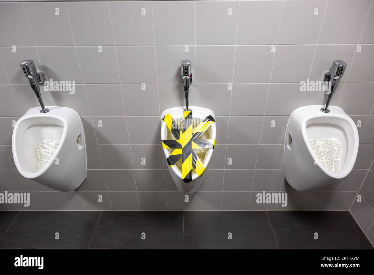 Munich, Germany. 27th Apr, 2023. A urinal blocked with yellow and black ...