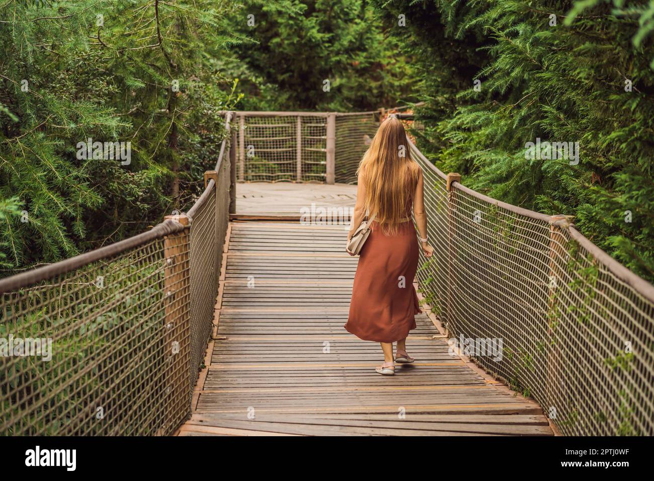 Woman tourist in Rope bridge in Yildiz Park. Besiktas, Istanbul, Turkey ...