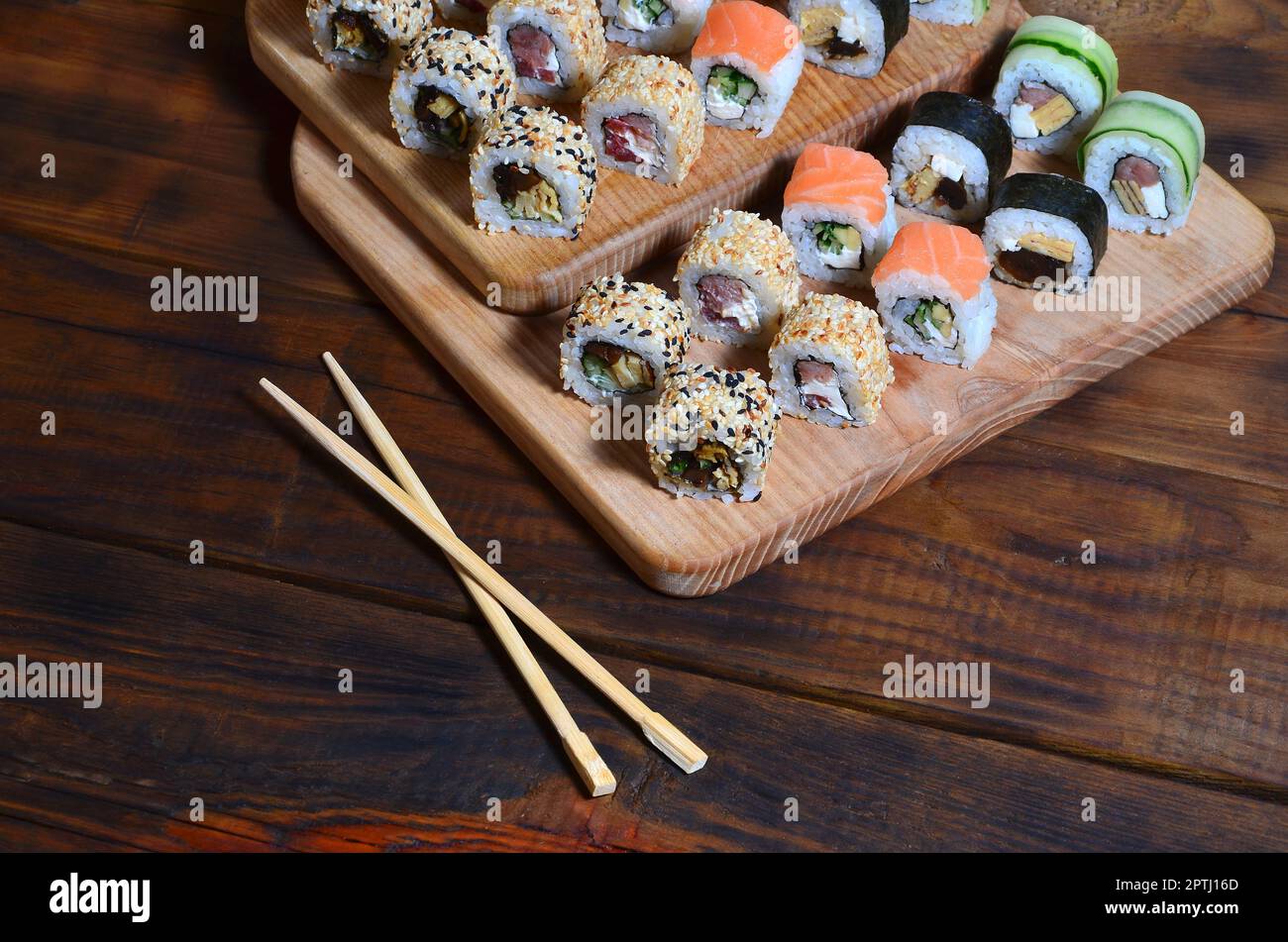 A detailed shot of a set of Japanese sushi rolls and a device for their ...