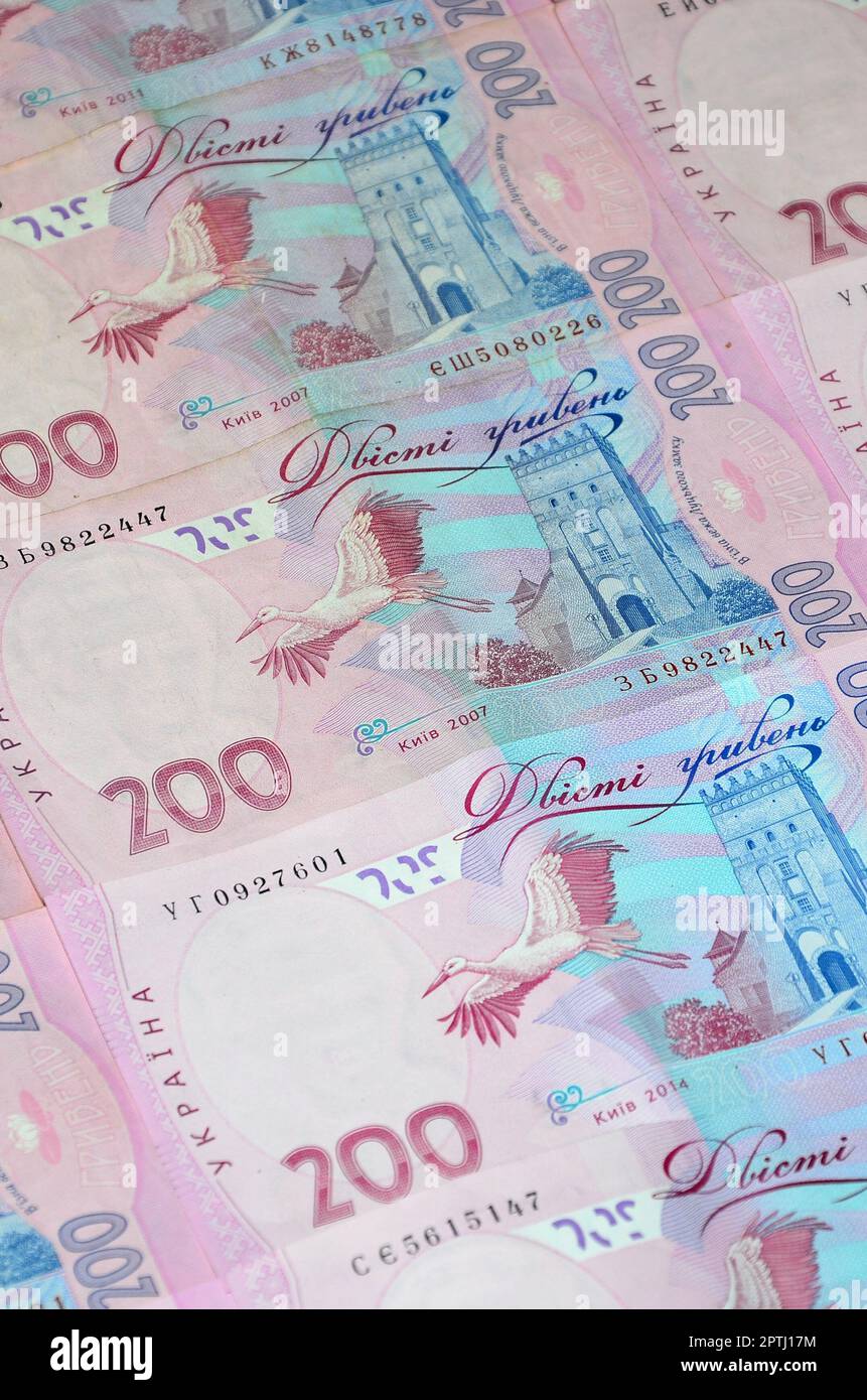 A close-up of a pattern of many Ukrainian currency banknotes with a par ...