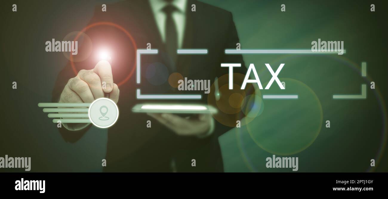 Sign displaying Tax, Word for compulsory financial charge imposed upon ...