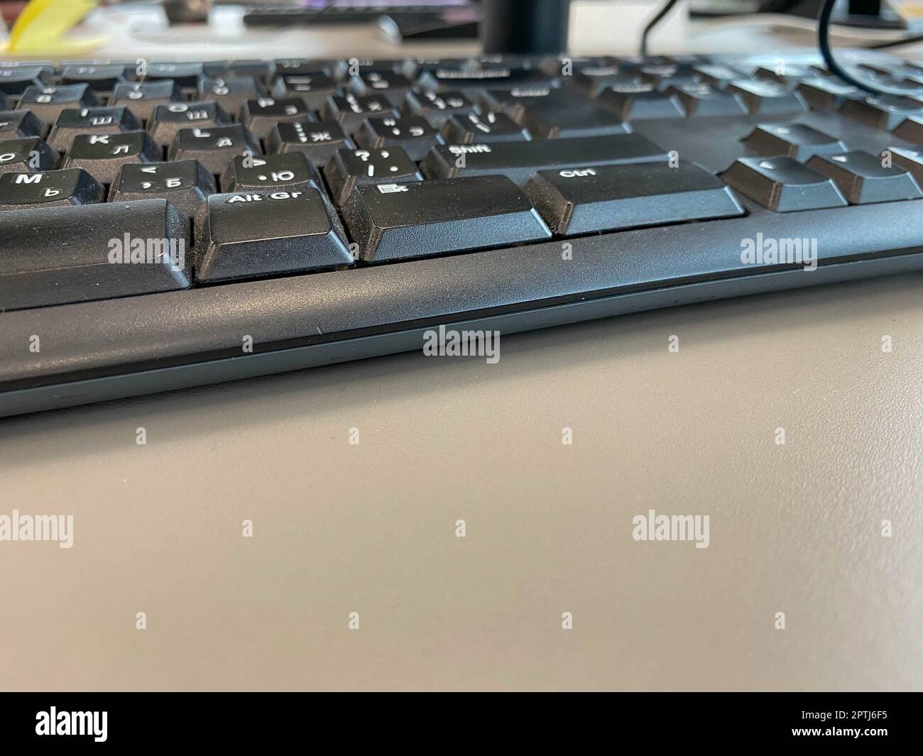 Black office computer plastic keyboard with buttons for typing text in ...