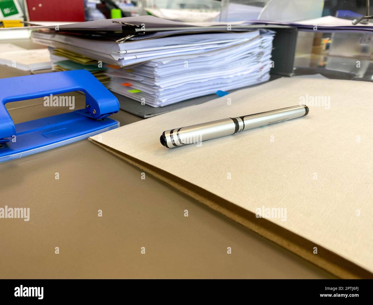 Large thick folders with important papers and documents on a working ...