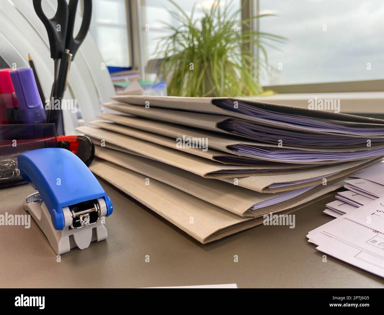 Large thick folders with important papers and documents on a working ...