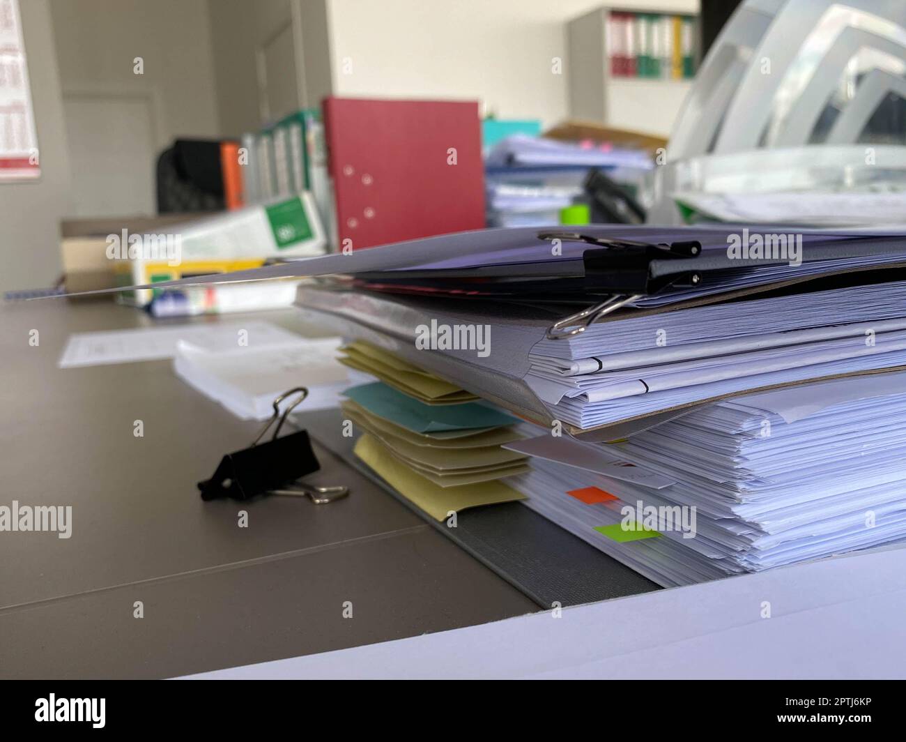 Large thick folders with important papers and documents on a working ...