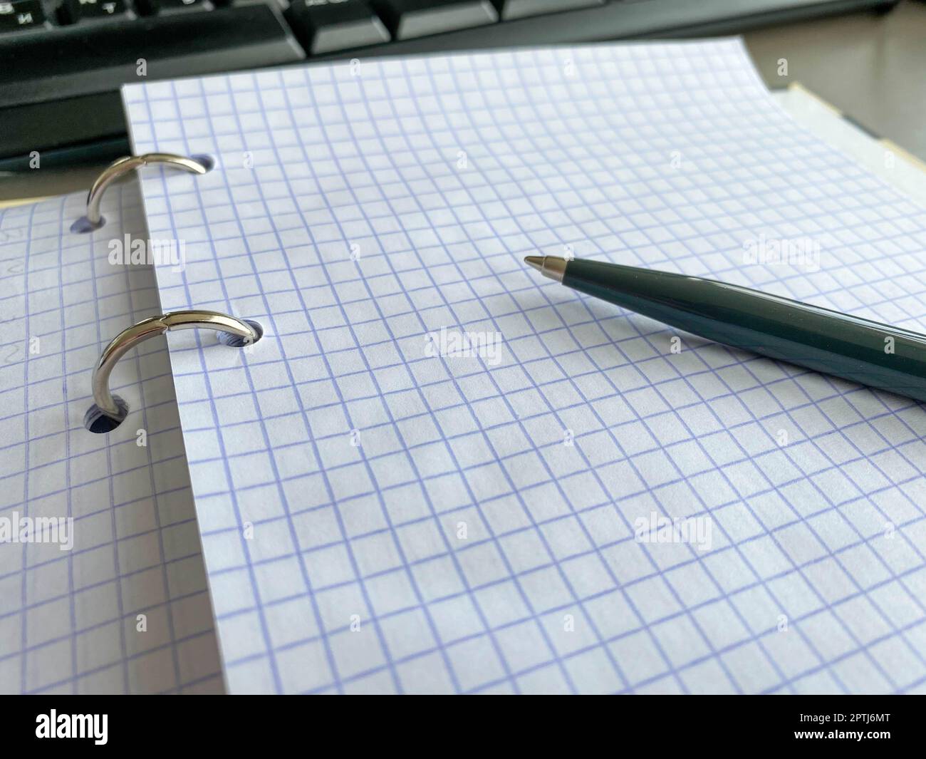 Clean notepad with pen on wooden office desk or white background. Next ...