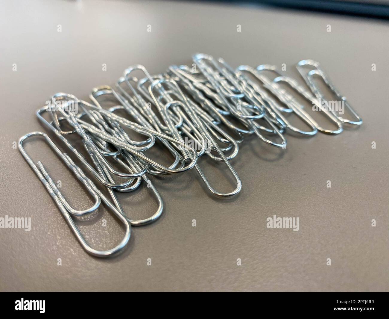 Metal paper clips . The idea for the design of school notebooks Stock ...