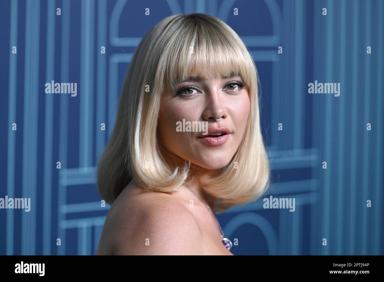 New York, USA. 27th Apr, 2023. Florence Pugh walks the carpet as ...