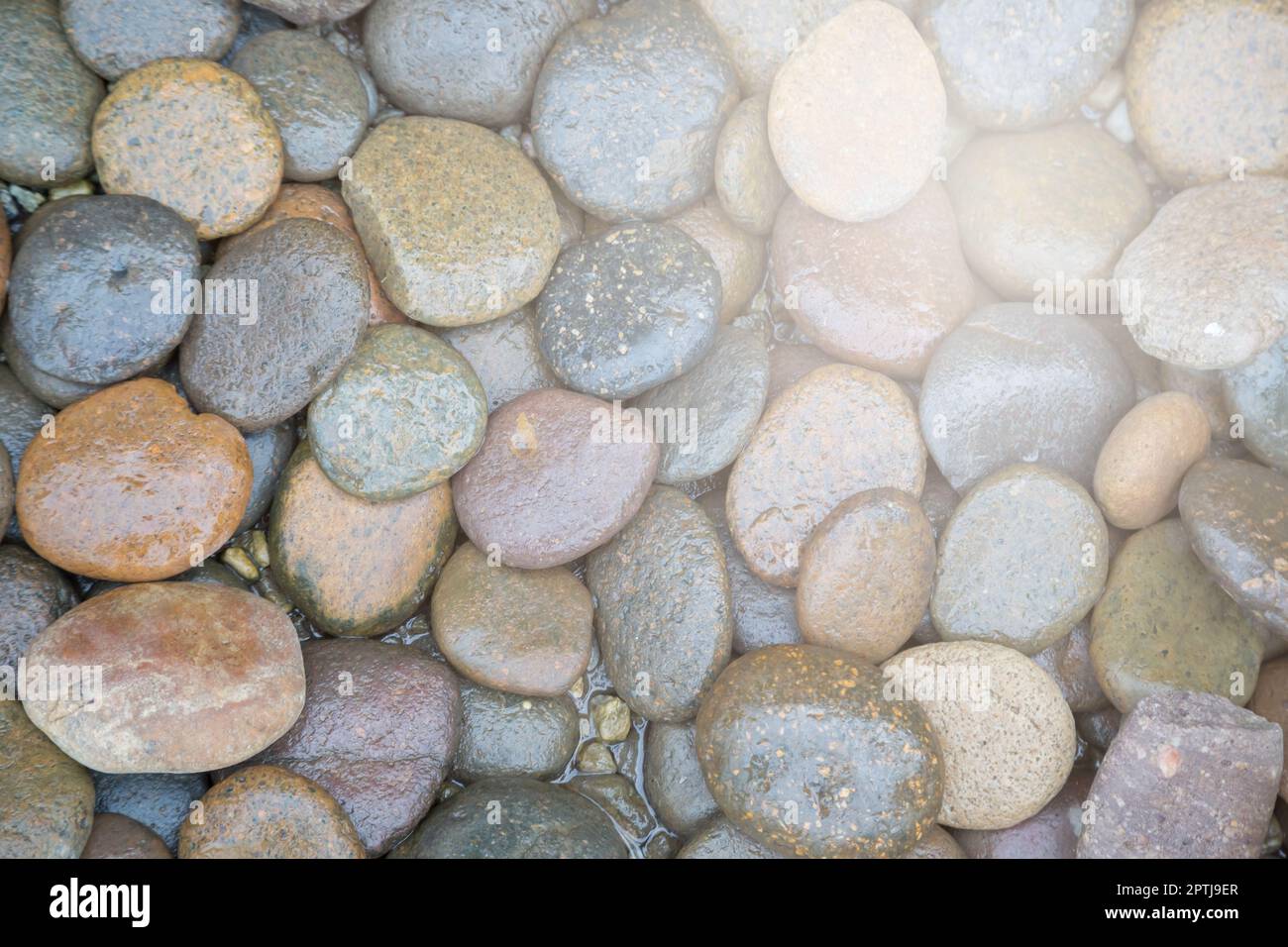 Wet rock river texture background Stock Photo - Alamy