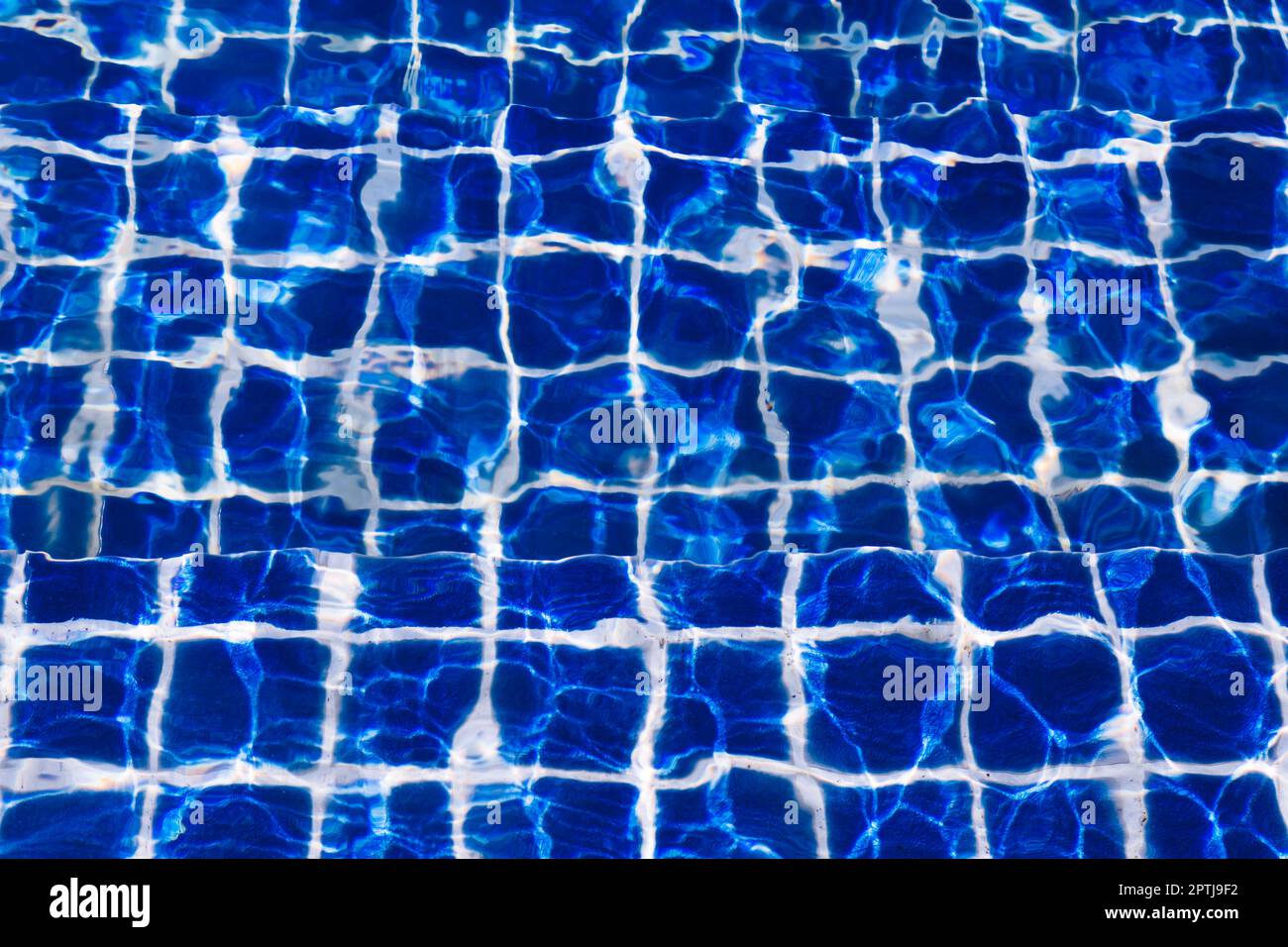 Blue color water in swimming pool rippled background Stock Photo - Alamy